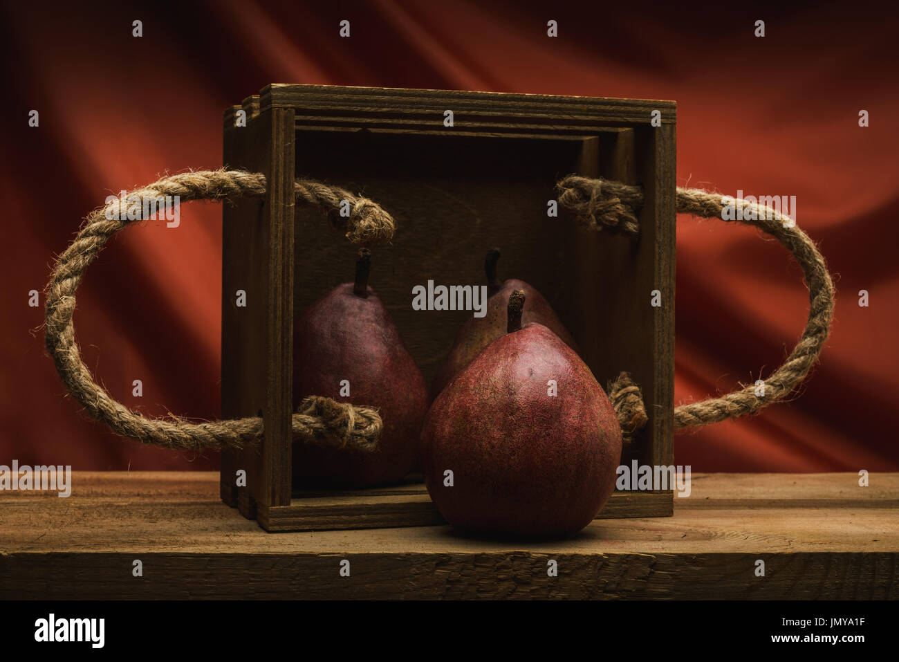 Still life: red pears in a wooden vintage box. Photos for printing ...