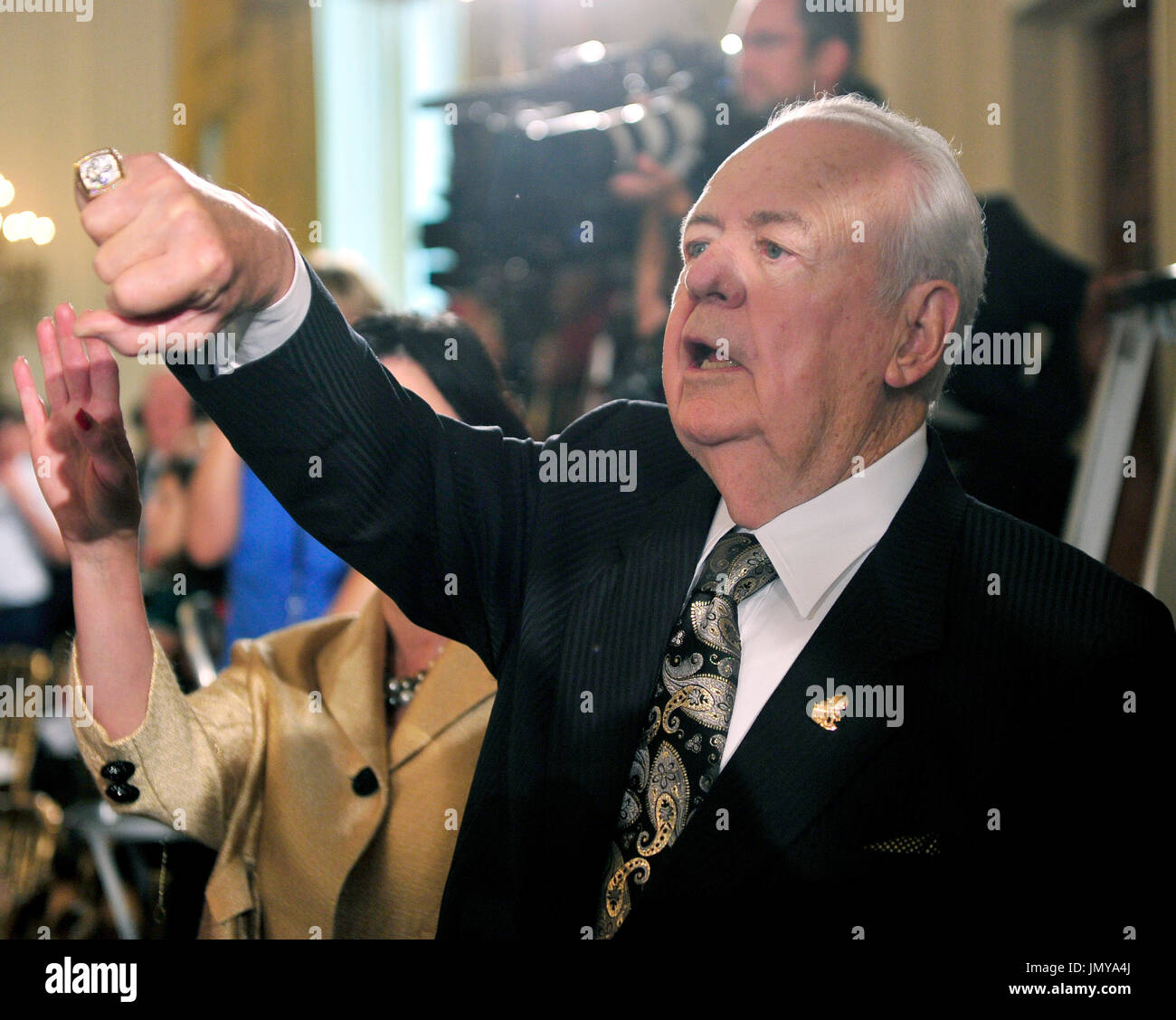 New Orleans Saints football team owner Tom Benson shows off his ...
