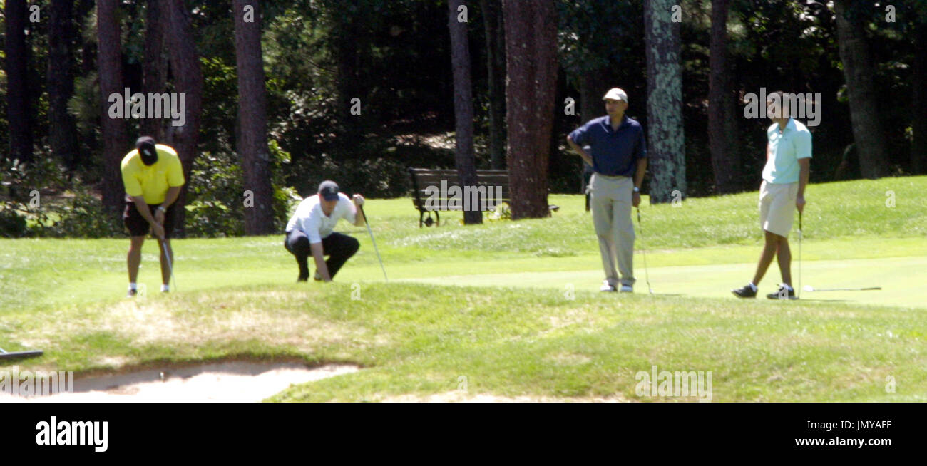 United States President Barack Obama watches long-time friend Eric ...