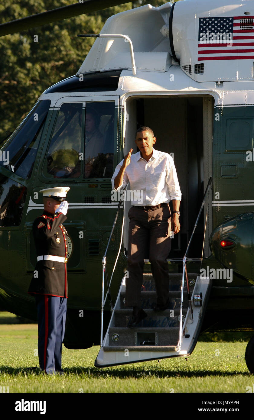 United States President Barack Obama salutess the Marine Guard as he ...