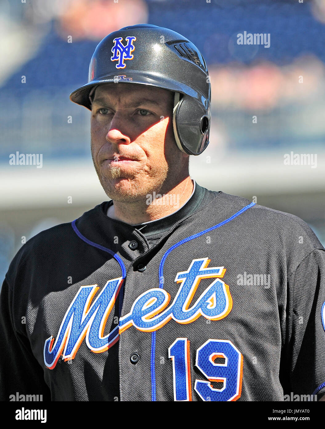 New York Mets infielder Mike Hessman (19) returns to the dug-out after ...