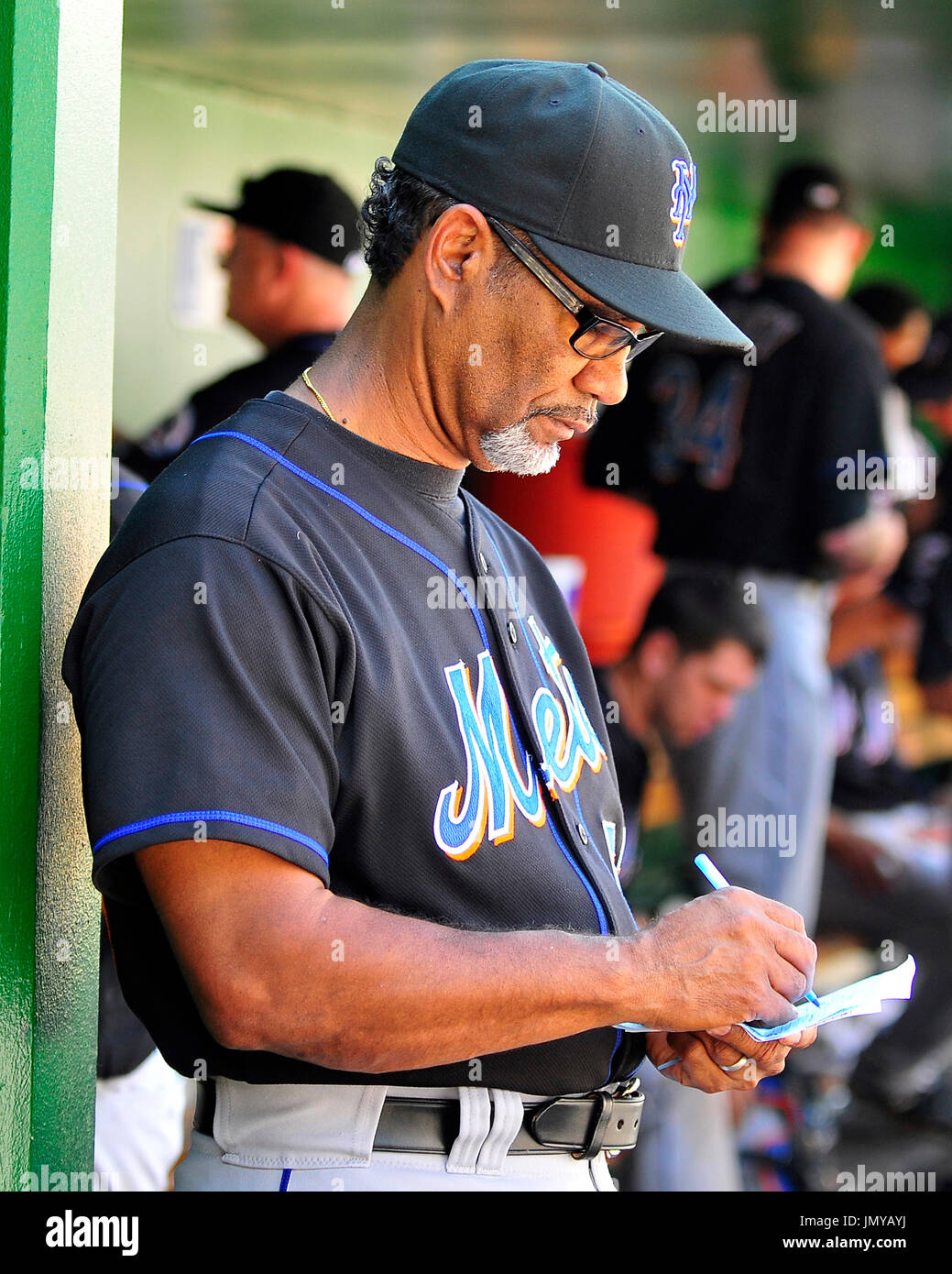 New York Mets manager Jerry Manuel (53) writes some notes in the ninth ...