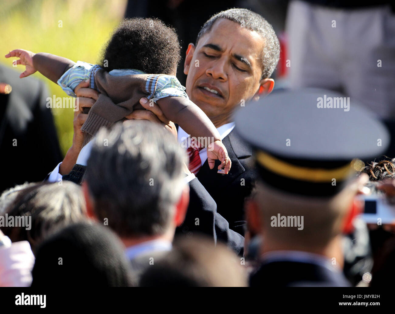 United States President Barack Obama holds up a baby as he greets ...