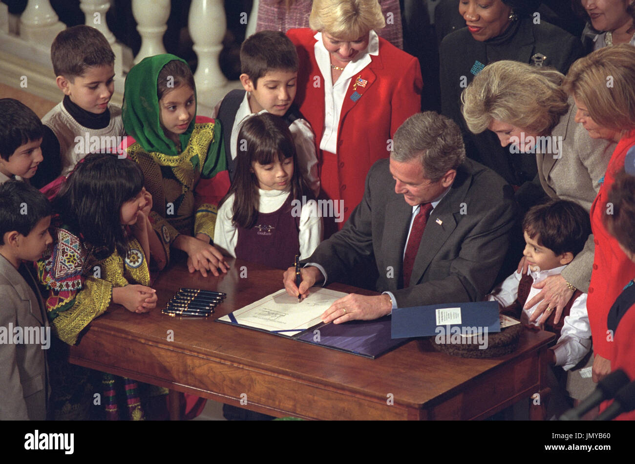 United States President George W. Bush signs the Afghan Women and ...