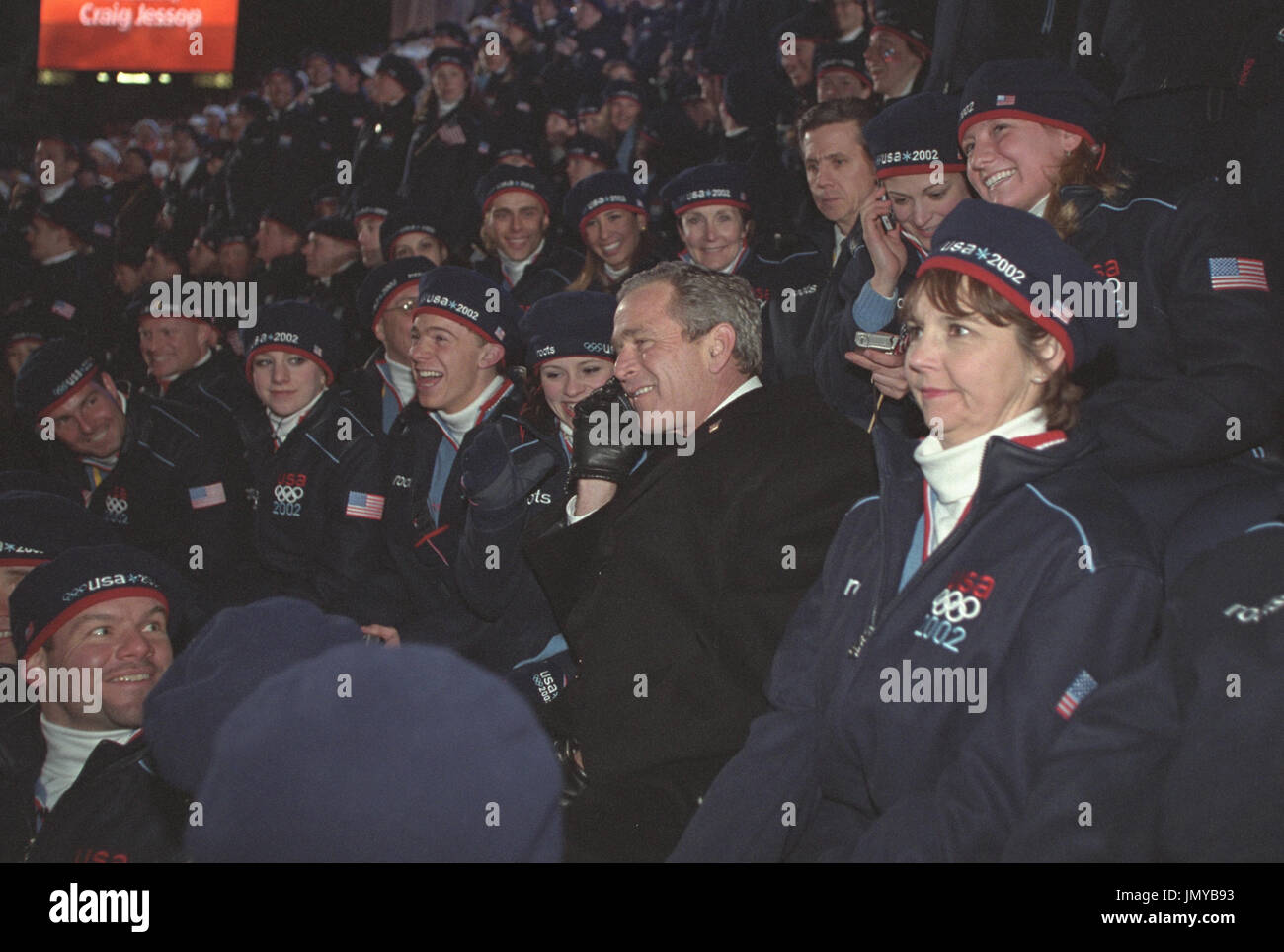 United States President George W. Bush speaks on a cell phone as he ...