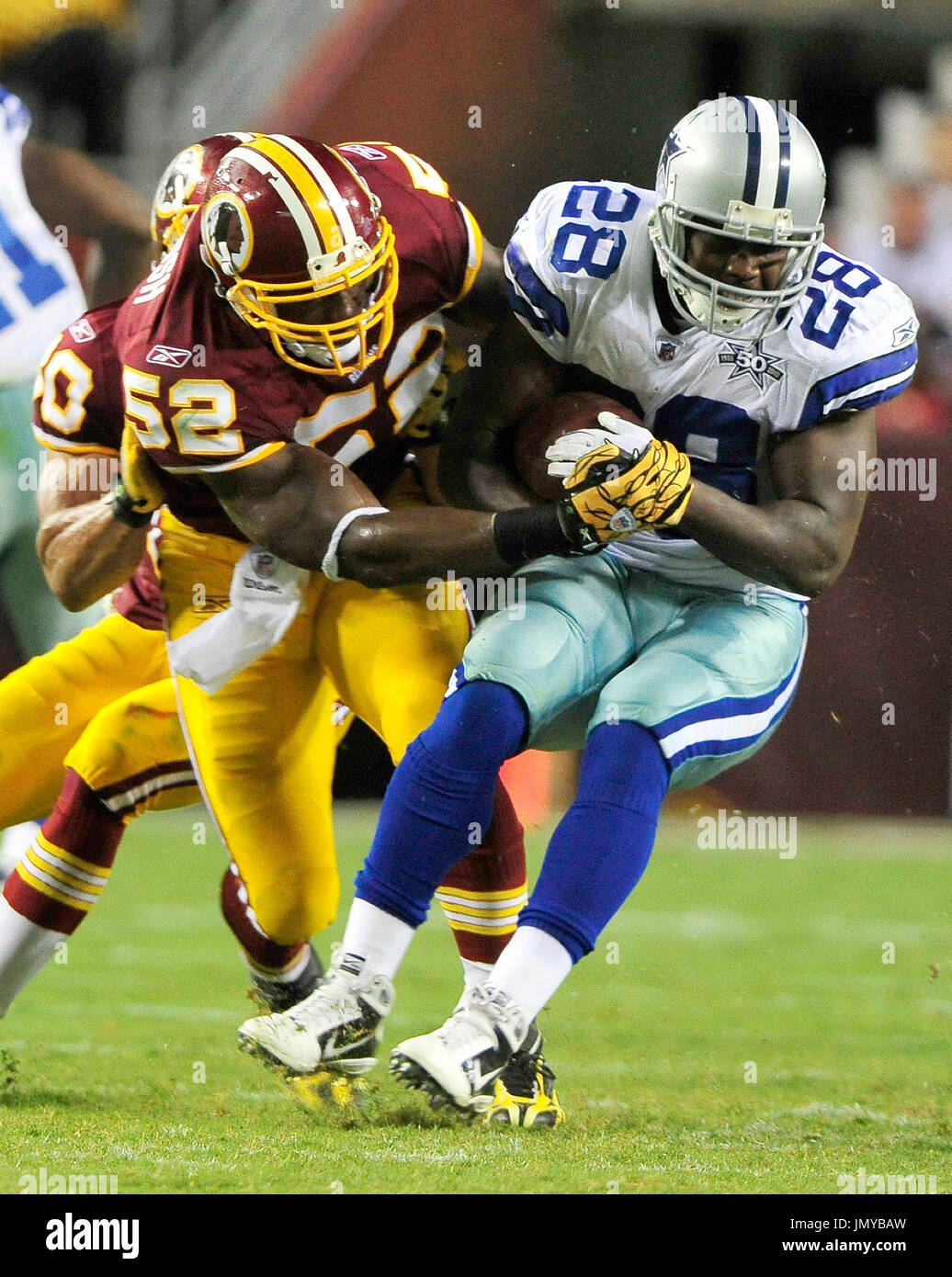 Dallas Cowboys running back Felix Jones (28) is tackled by Washington ...