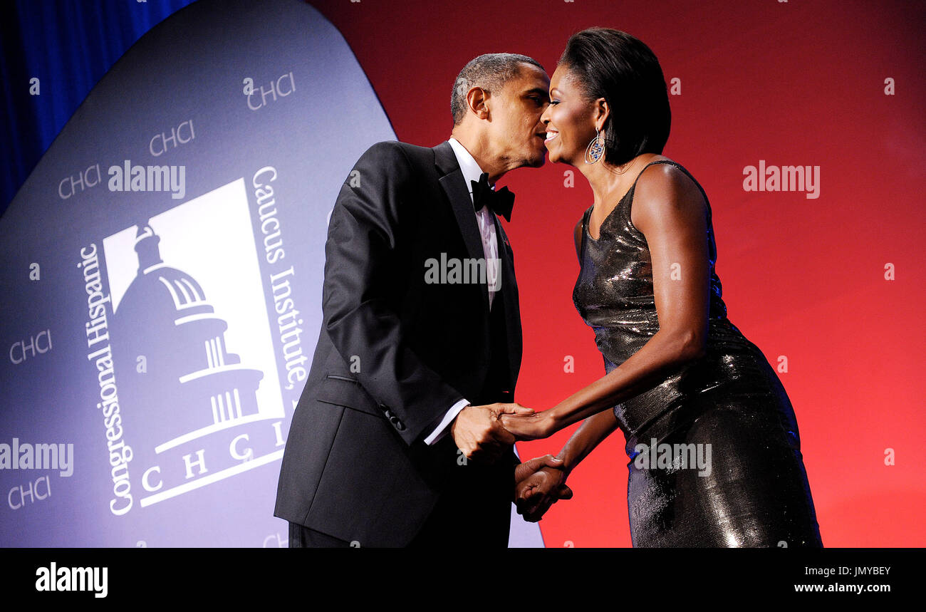 United States President Barack Obama and First Lady Michelle Obama kiss ...