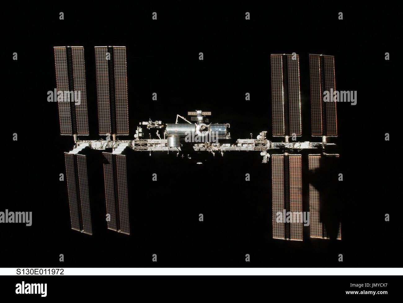 Surrounded by the blackness of space, the International Space Station ...