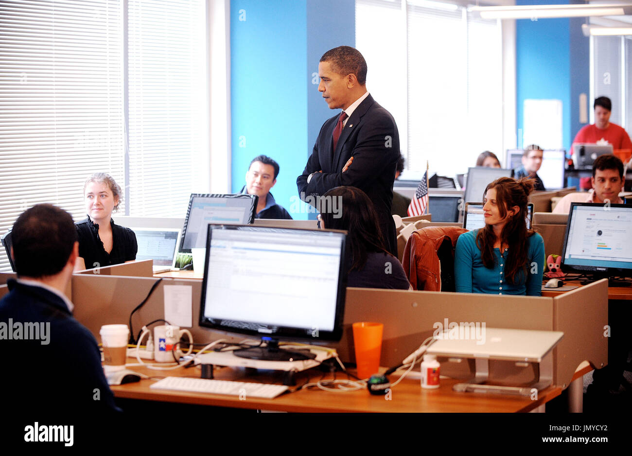 United States President Barack Obama gets some information from ...