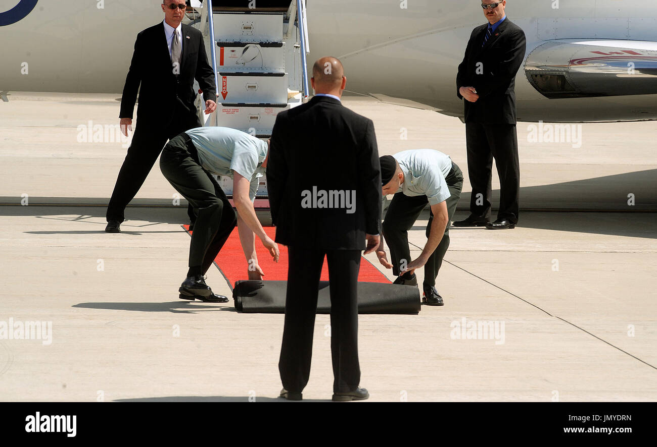 Security and Air Force personnel put the red carpet for the arrival of ...