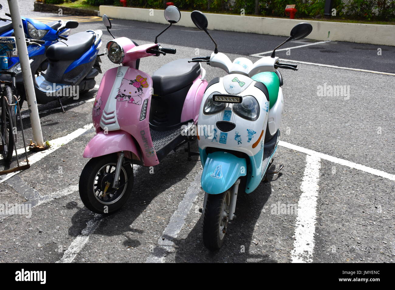 Some cute scooters parked at a Starbucks coffee shop in Kenting, Taiwan ...