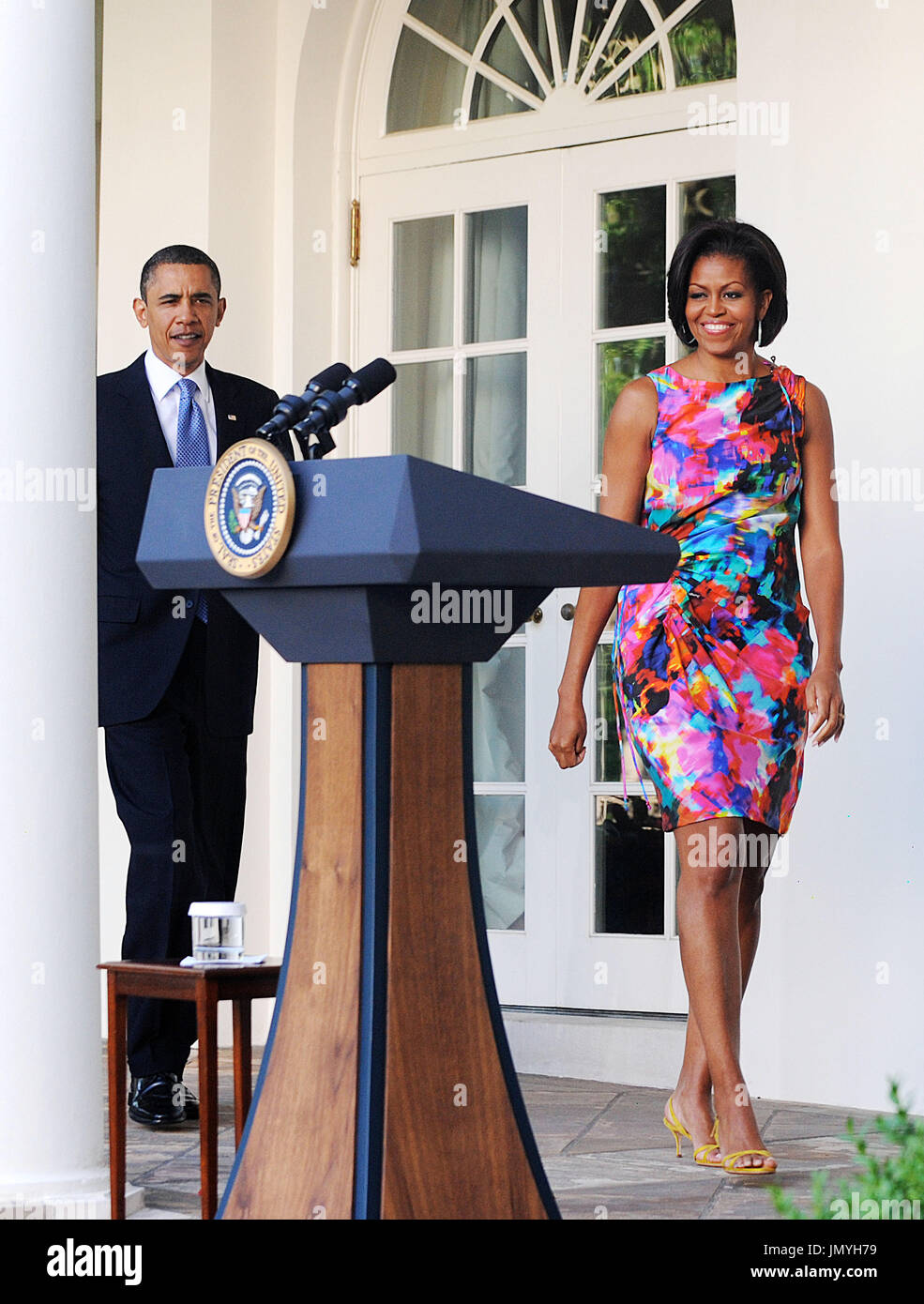 United States President Barack Obama and First Lady Michelle Obama walk ...