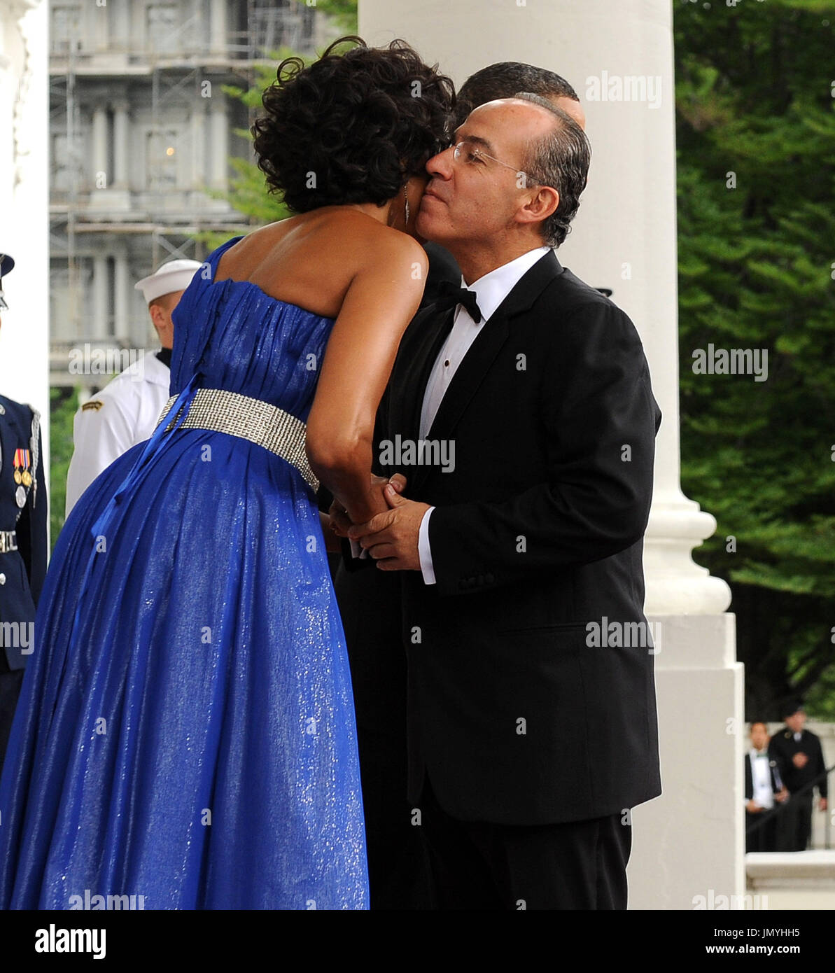 First Lady Michelle Obama embraces Mexican President Felipe Calderon as ...