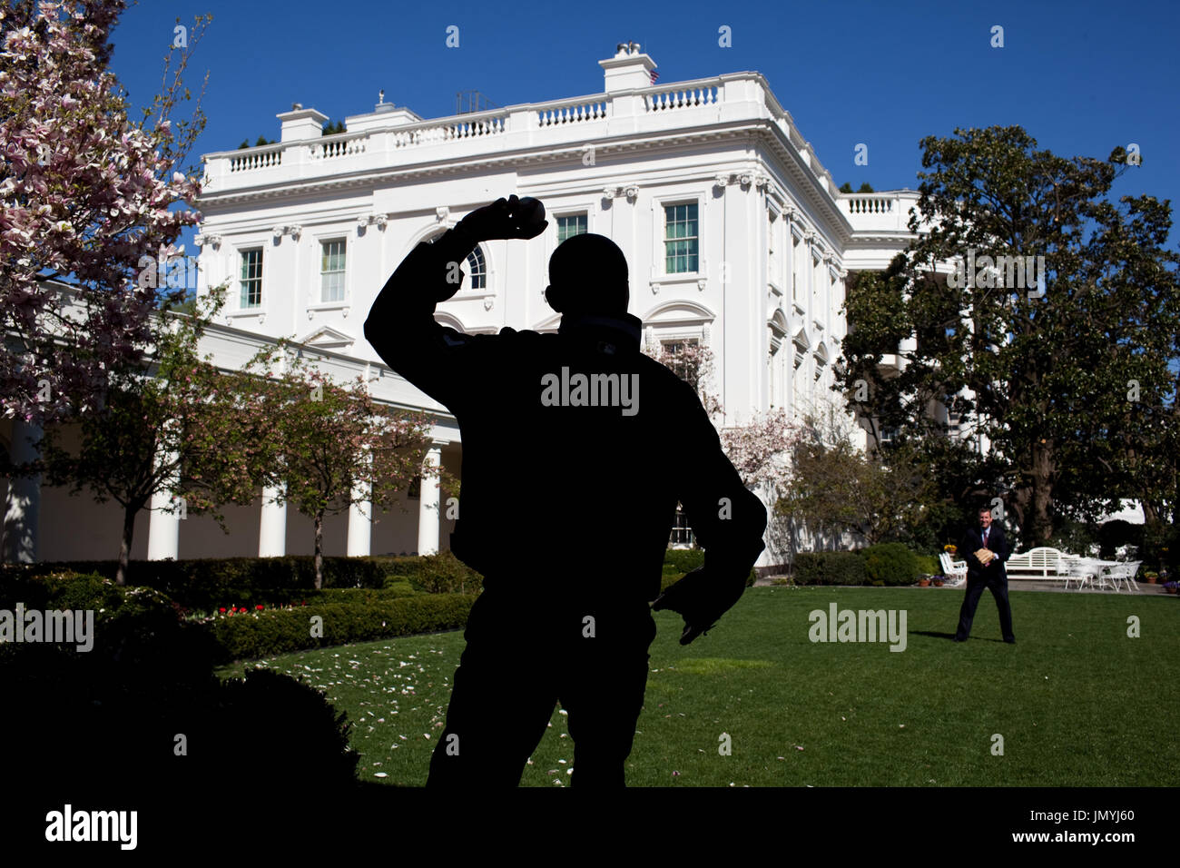 United States President Barack Obama practices his pitching with TK in ...