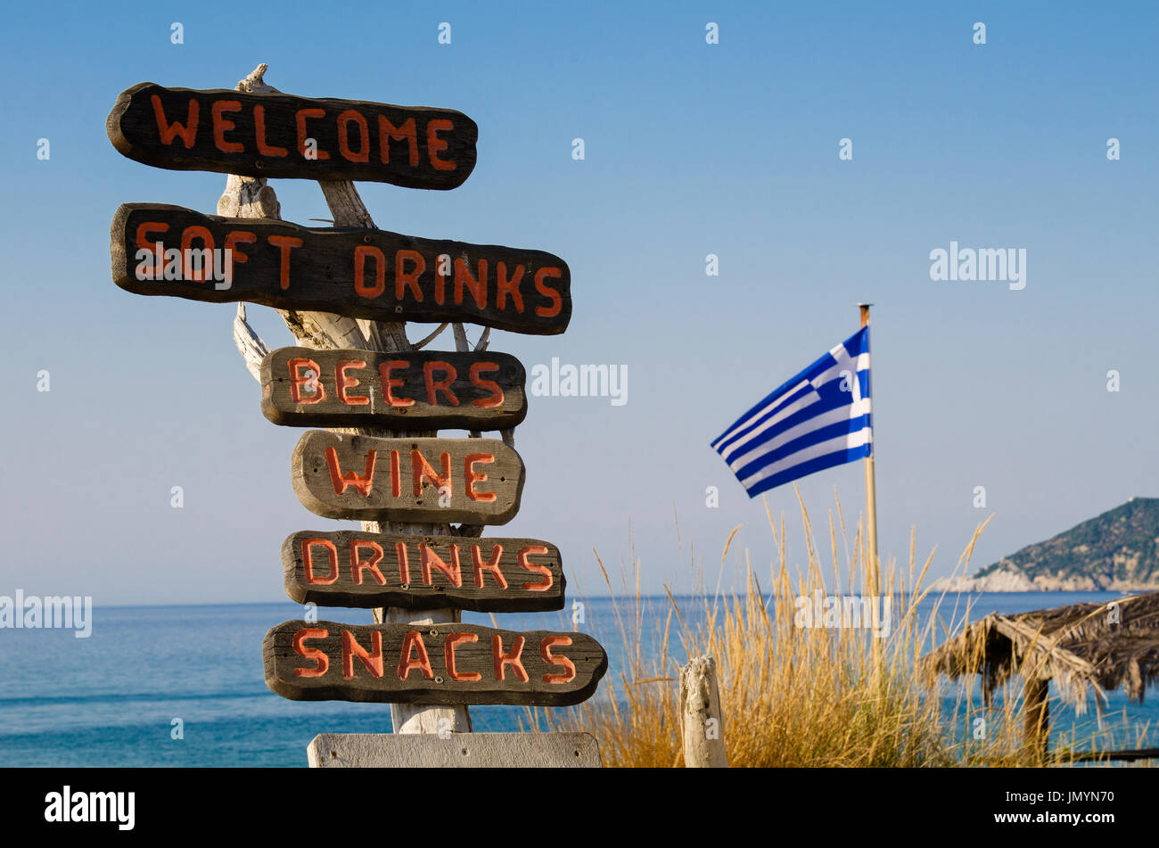 Wooden signposts on the beach indicate the presence of a bar offering ...