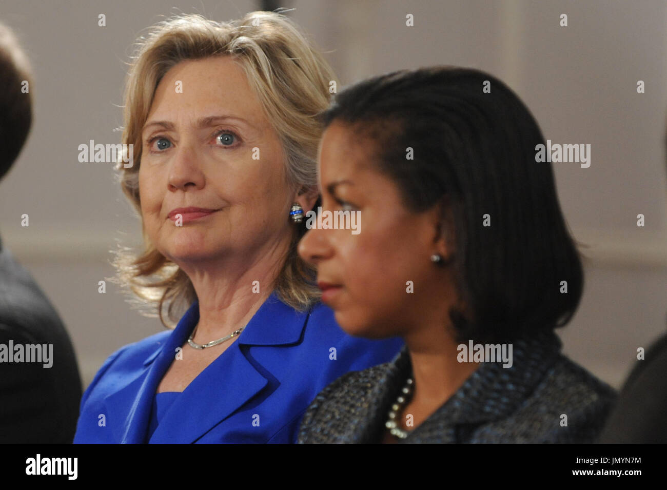 United States Secretary of State Hillary Clinton (L) and US Ambassador ...