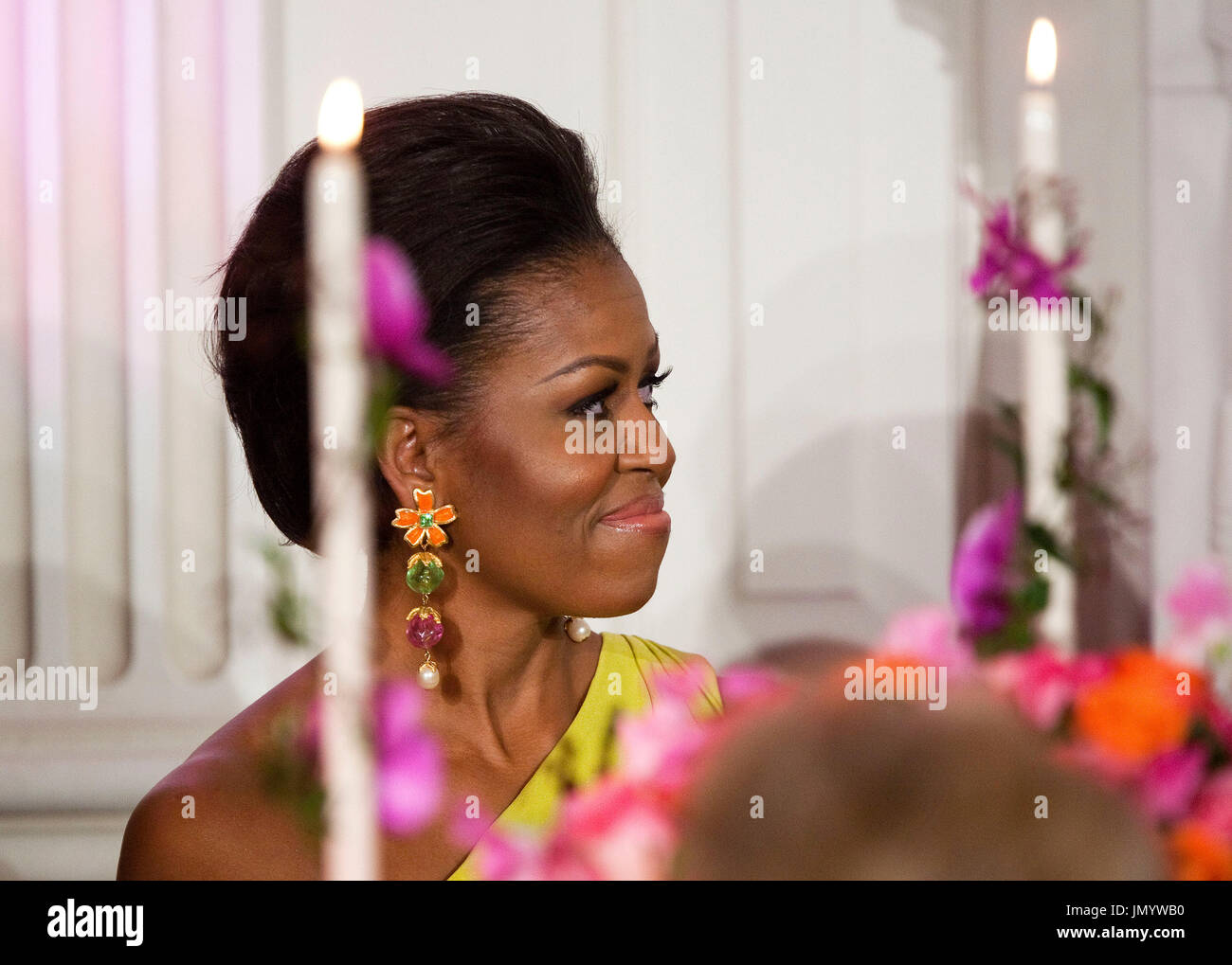 First Lady Michelle Obama listens as U.S. President Barack Obama makes ...