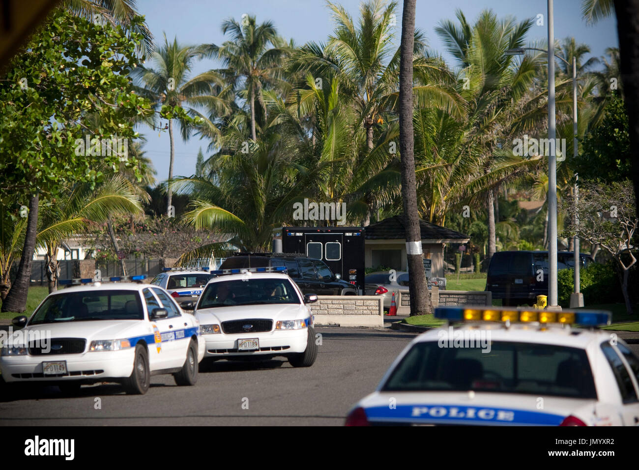 Honolulu Police Department vehicles stand by on the street as United ...