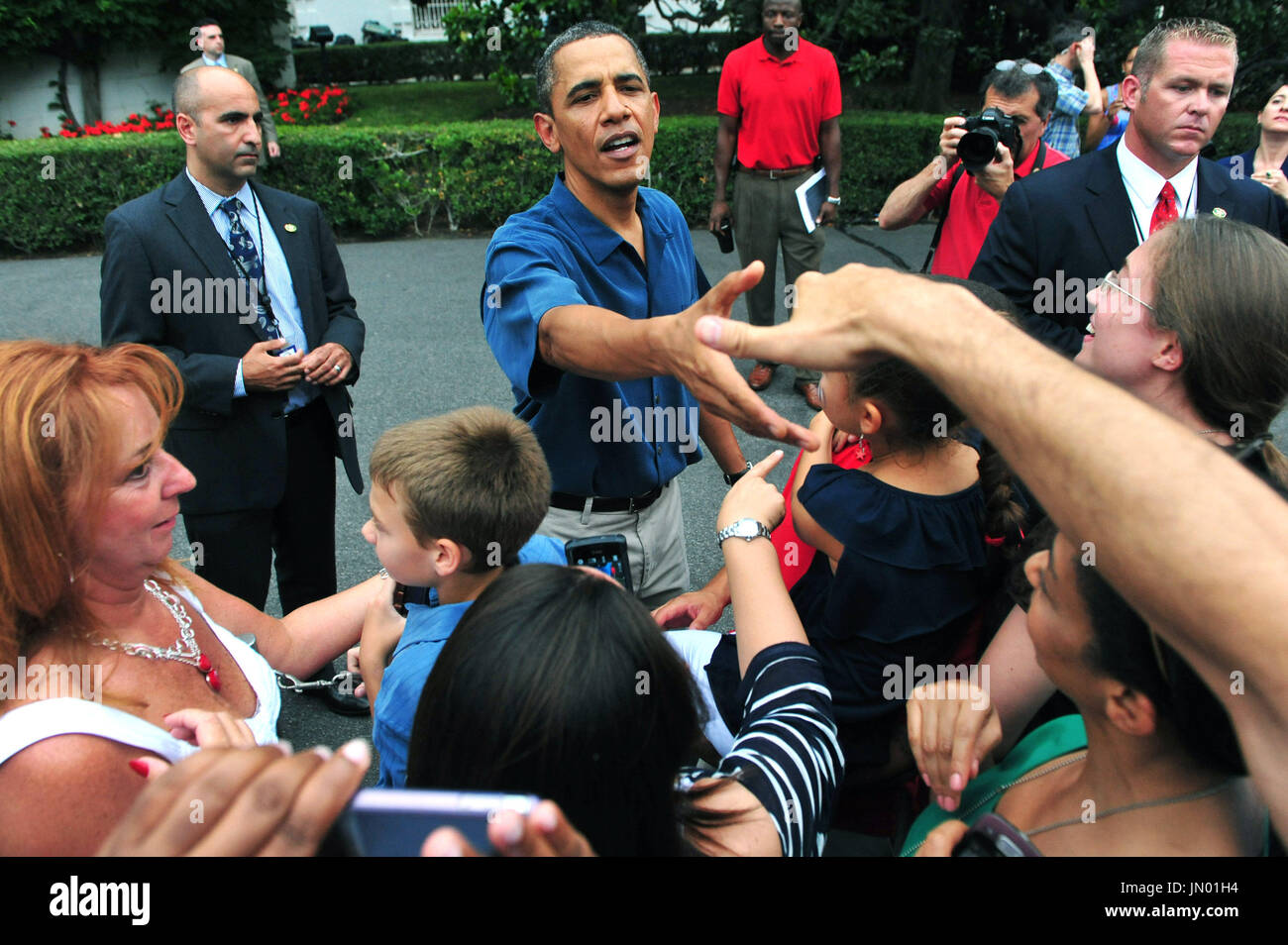 United States President Barack Obama greets members of the crowd as he ...