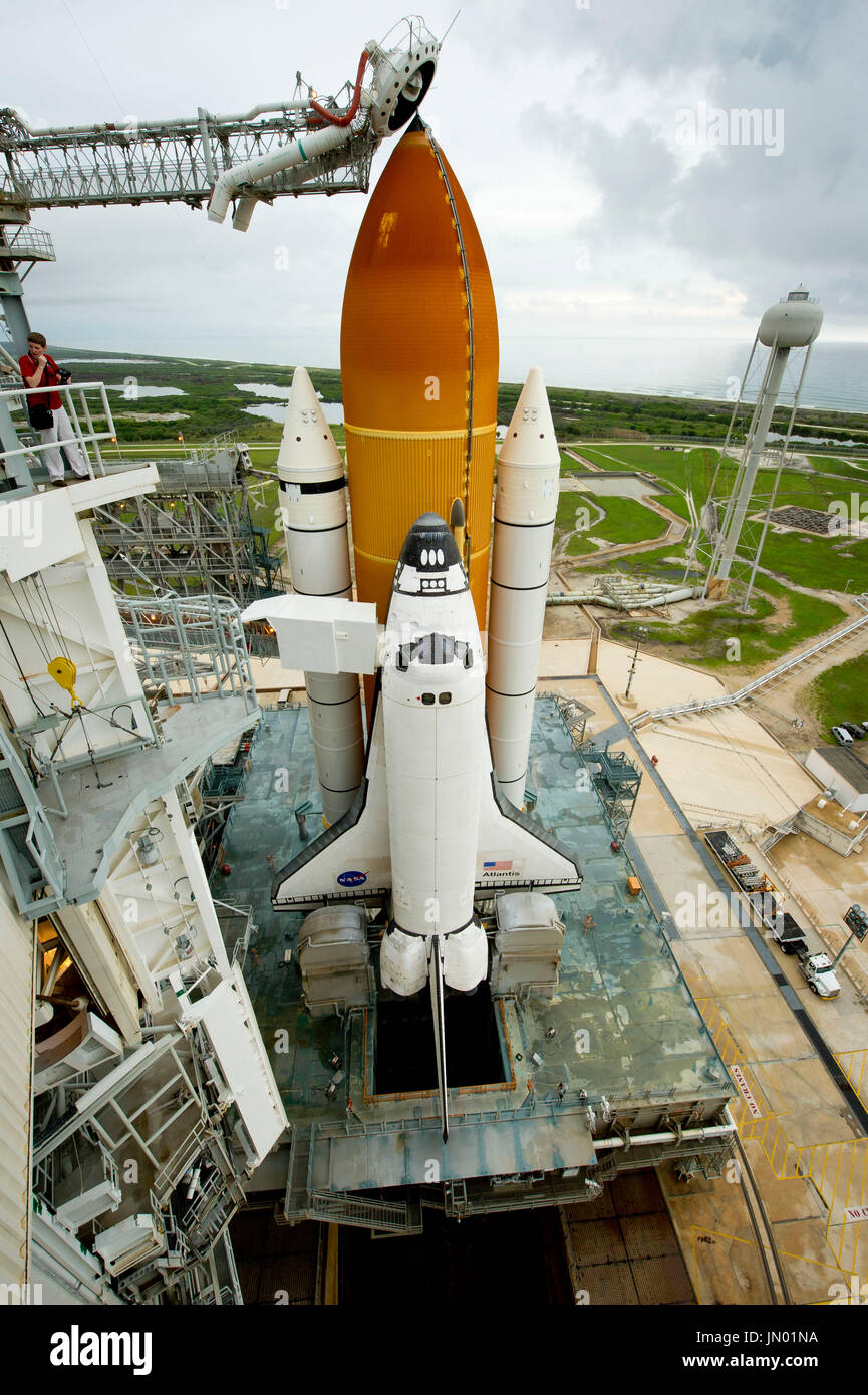 The space shuttle Atlantis is revealed as the rotating service ...