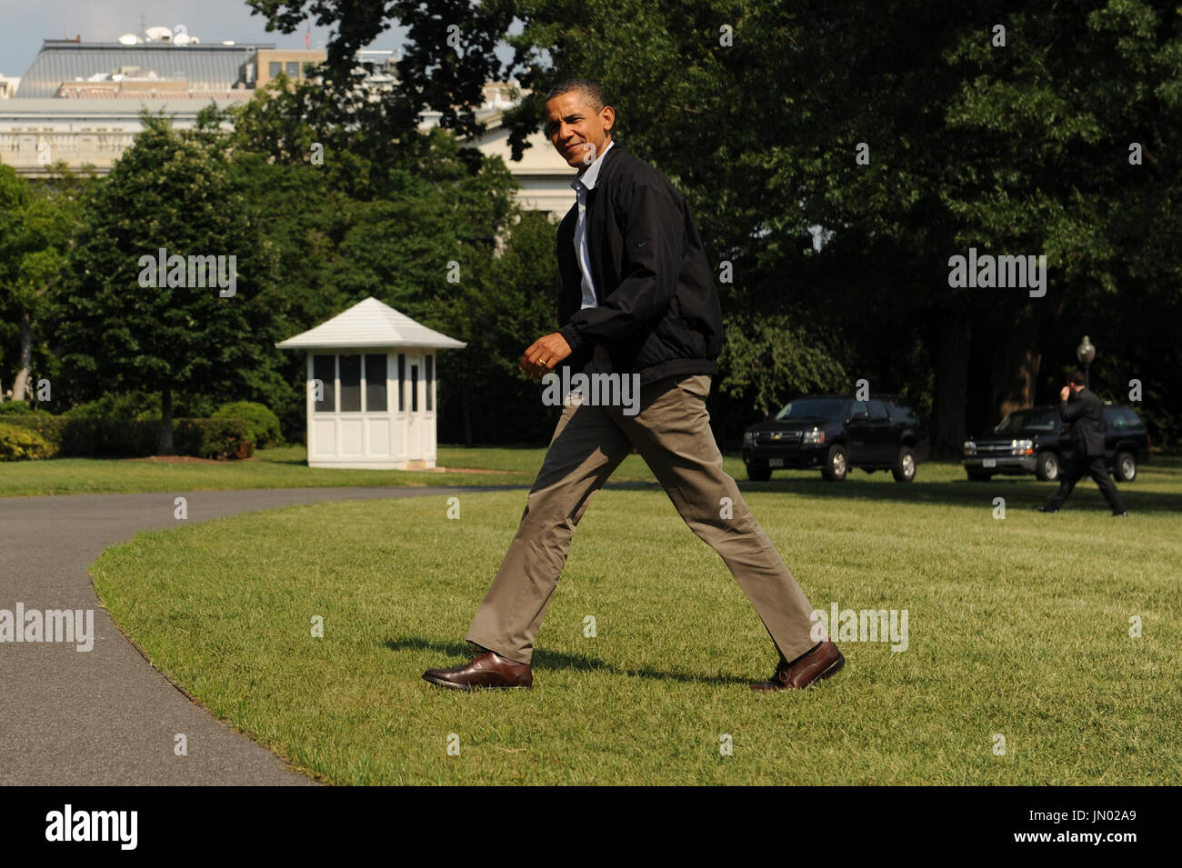 United States President Barack Obama walks across the South Lawn of the ...