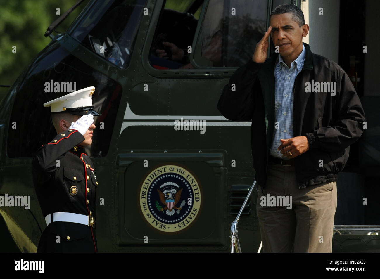 United States President Barack Obama (R) salutes a US Marine as arrives ...