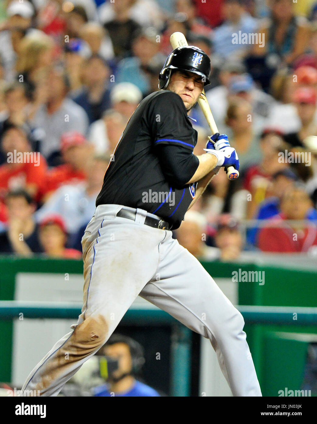 New York Mets catcher Josh Thole (30) back off from a pitch that hit ...