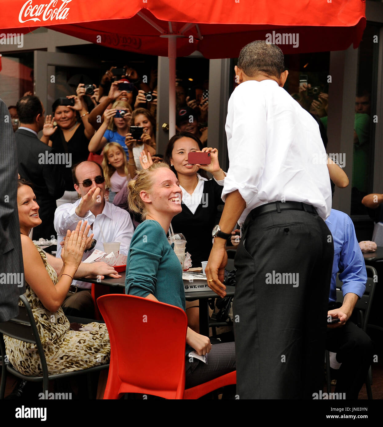 United States President Barack Obama greets people on the street as he ...