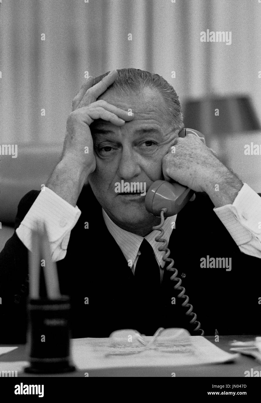 United States President Lyndon B. Johnson speaks on the telephone from ...