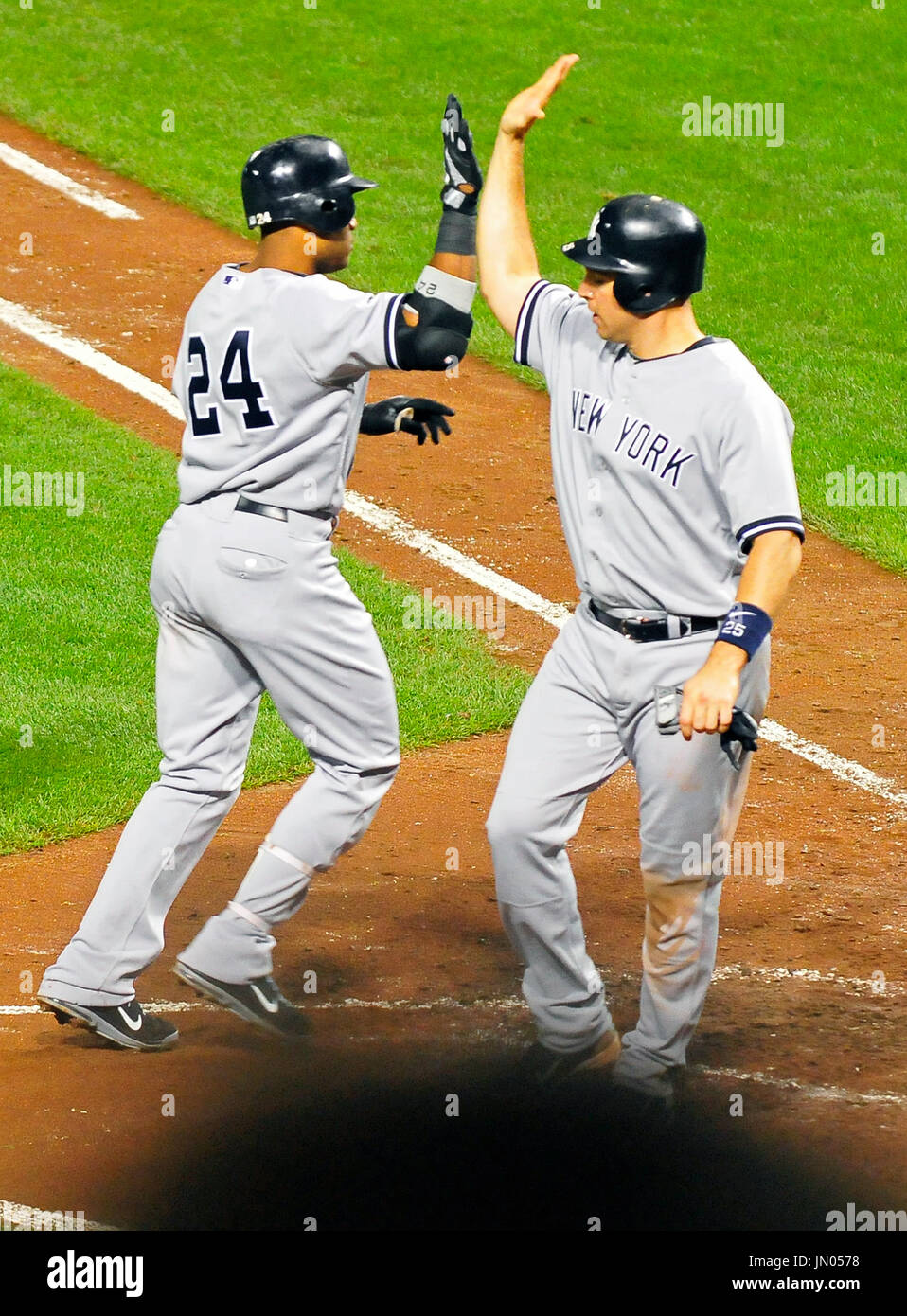 New York Yankees second baseman Robinson Cano (24) is congratulated by ...