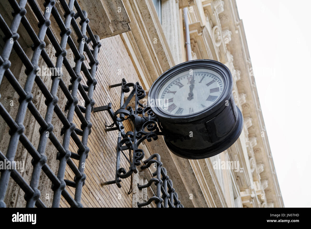 Street Clock at the building in Rome, Italy Stock Photo - Alamy