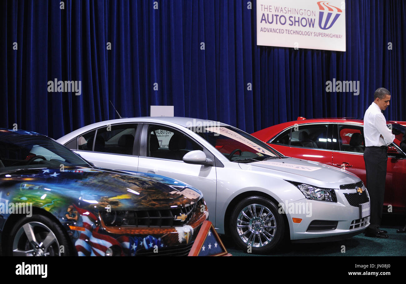 United States President Barack Obama looks at cars during a visit to ...