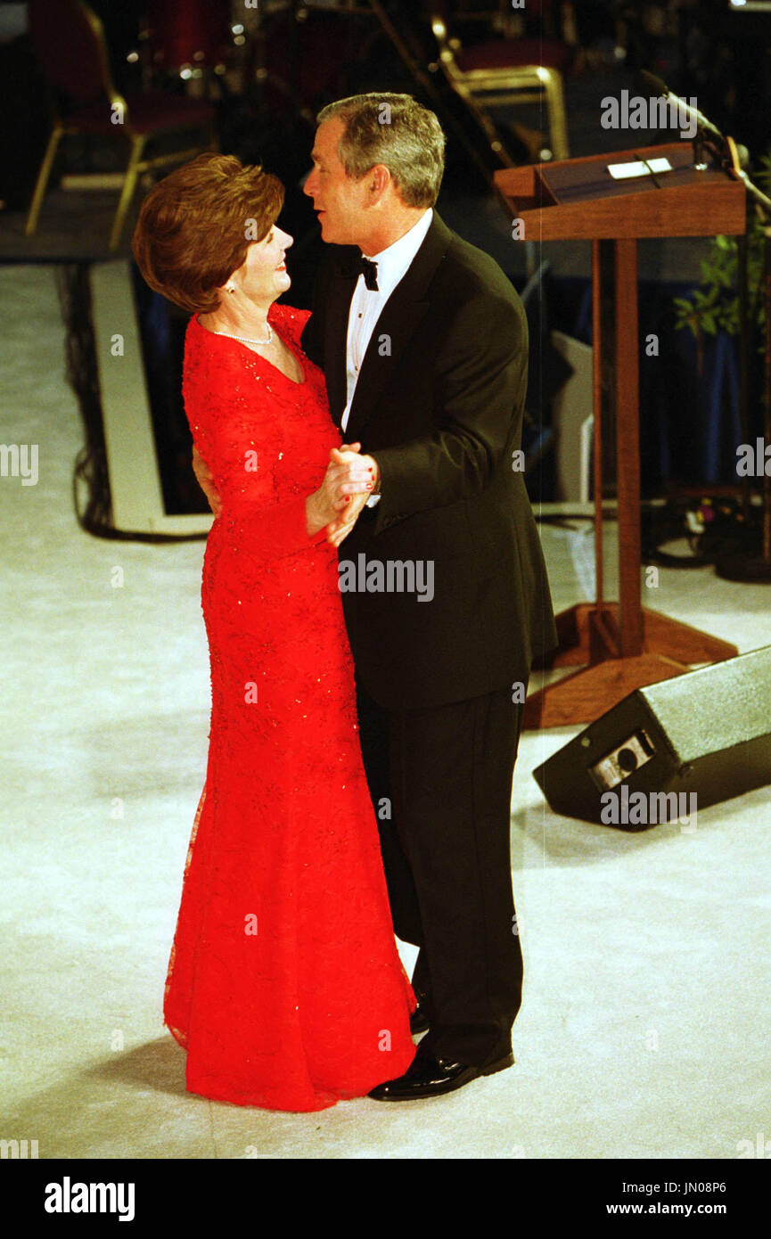 United States President George W. Bush and Laura Bush dance at one of ...