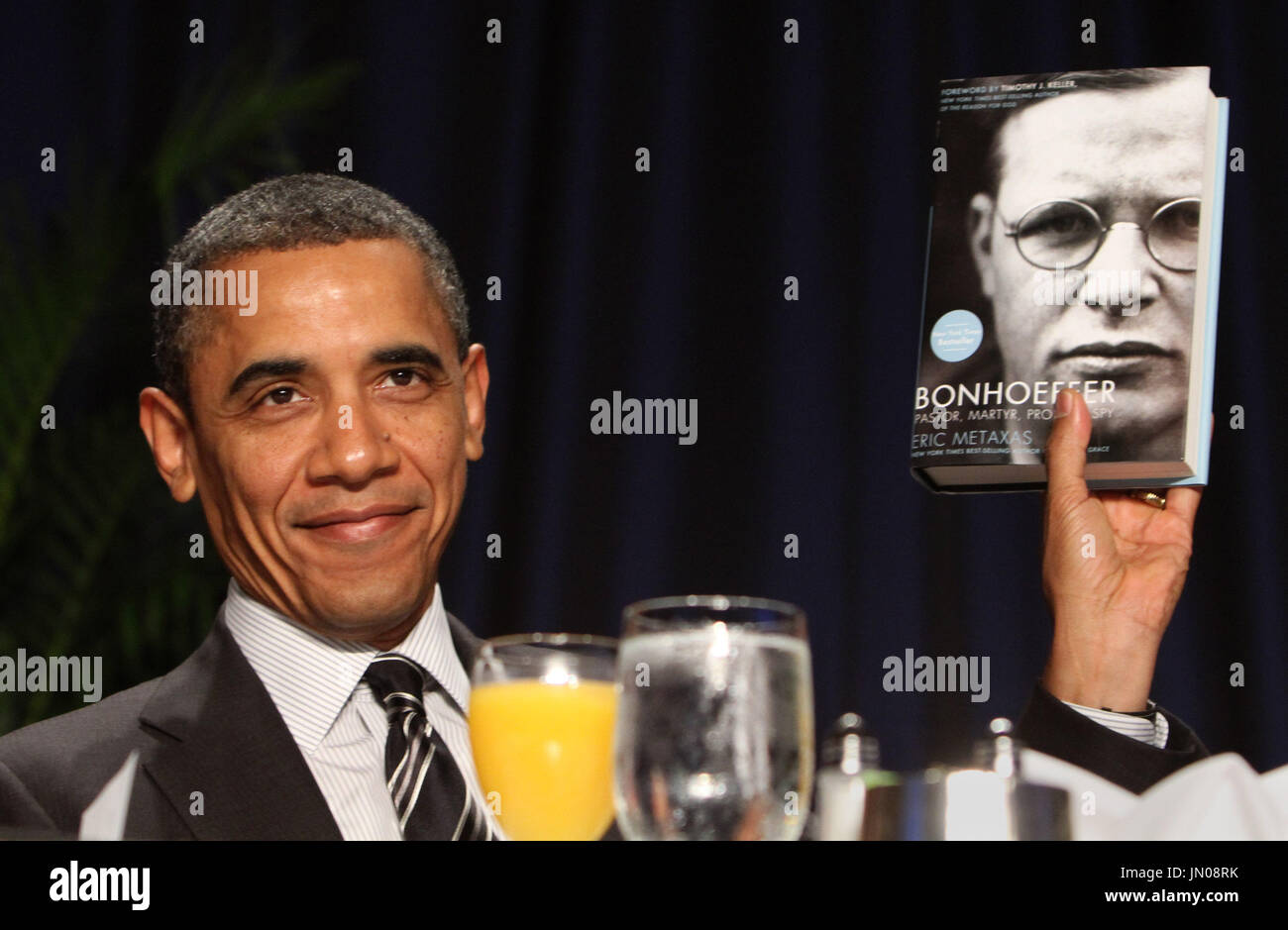 United States President Barack Obama shows a book given to him by ...