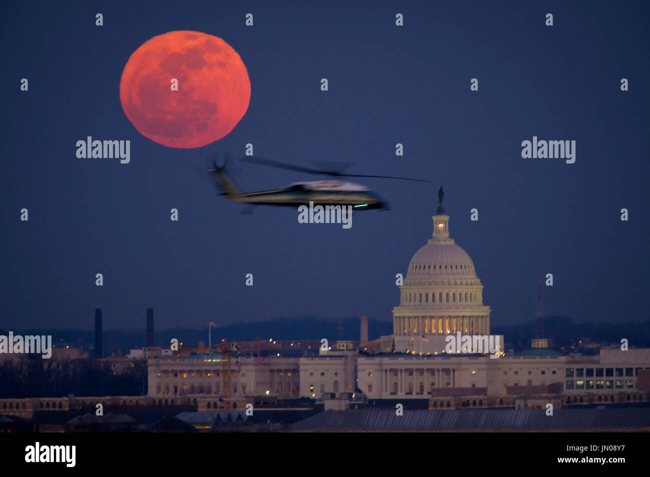 A United States Marine Corps helicopter is seen flying through this ...