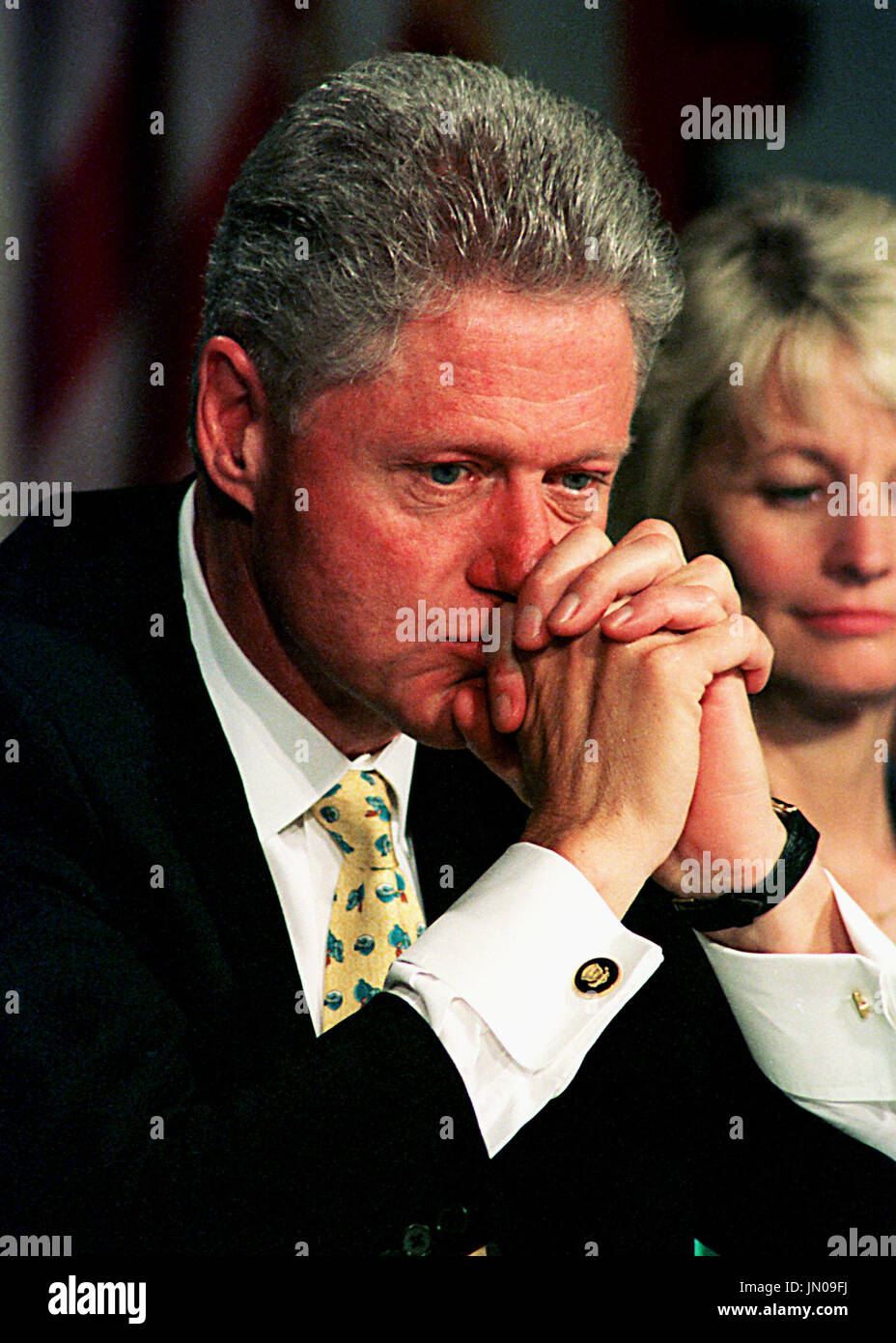United States President Bill Clinton listens to a presentation at an ...
