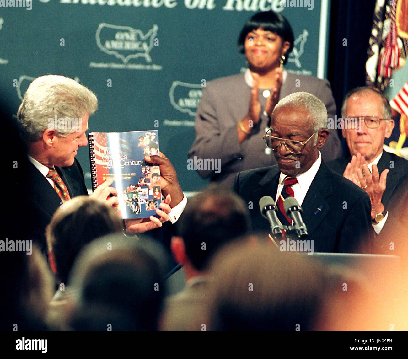 United States President Bill Clinton receives the report "One America ...