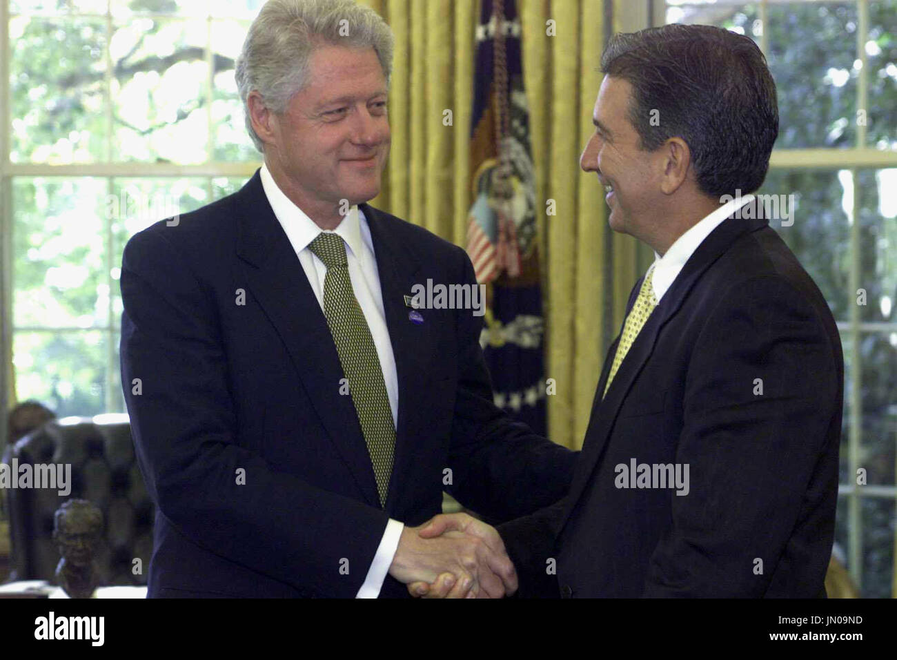 United States President Bill Clinton greets Governor Pedro Rossello of ...