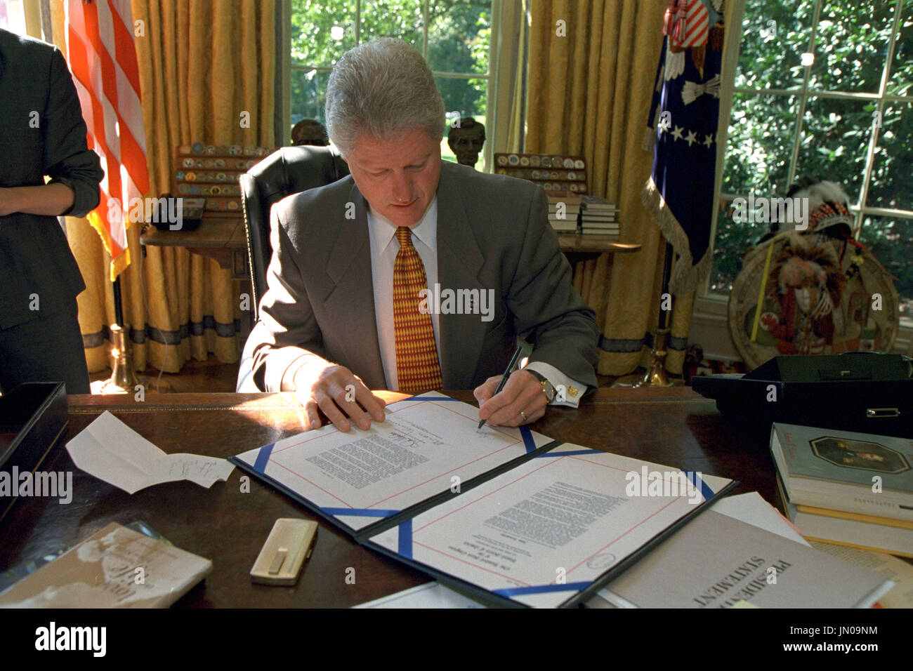 United States President Bill Clinton signs Continuing Resolution ...