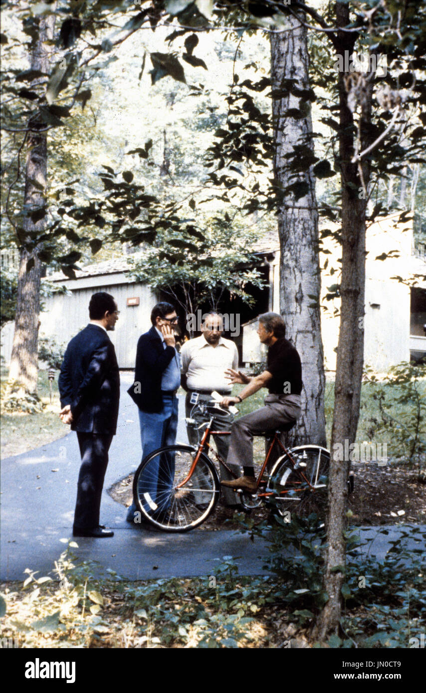 United States President Jimmy Carter, right, interrupts a ride on his ...