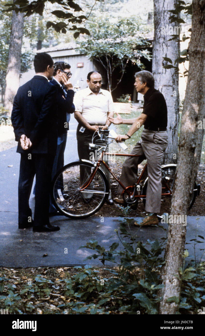 United States President Jimmy Carter, right, interrupts a ride on his ...
