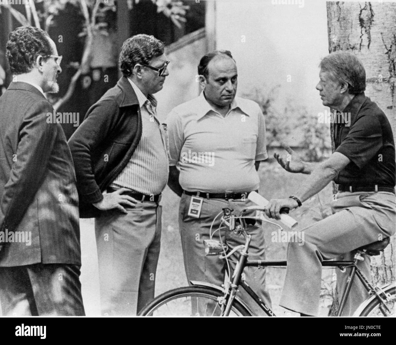 United States President Jimmy Carter, right, interrupts a ride on his ...