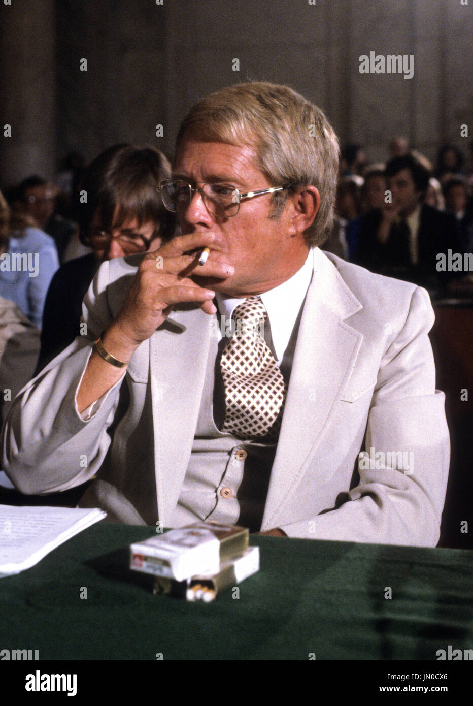 Billy Carter, brother of United States President Jimmy Carter, smokes a ...