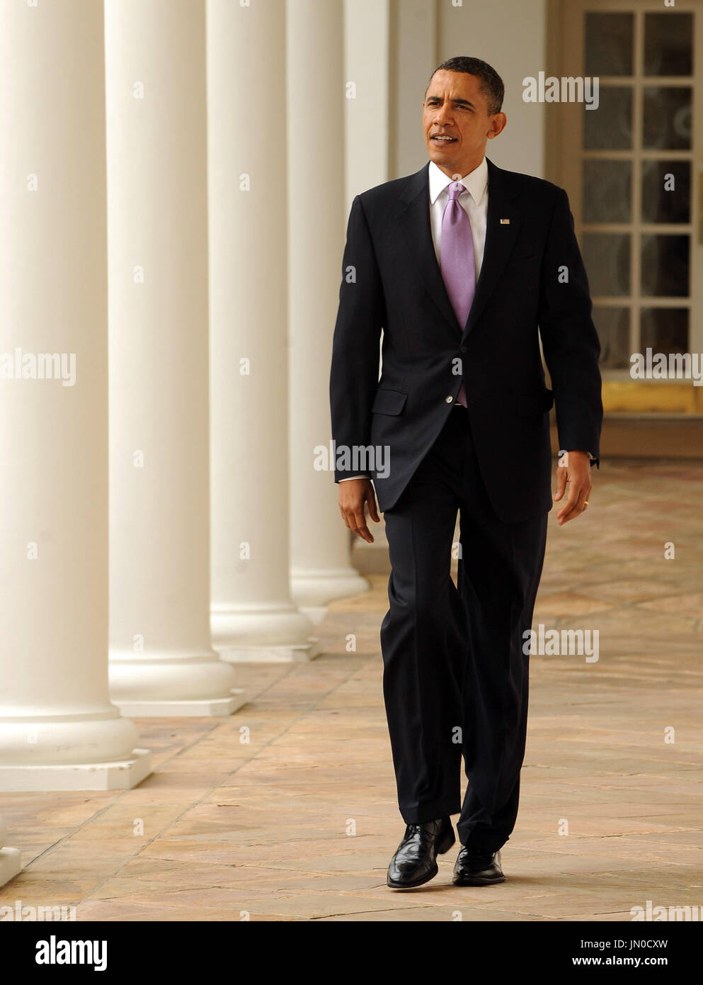 U.S. President Barack Obama walks through the Colonnade of the Rose ...