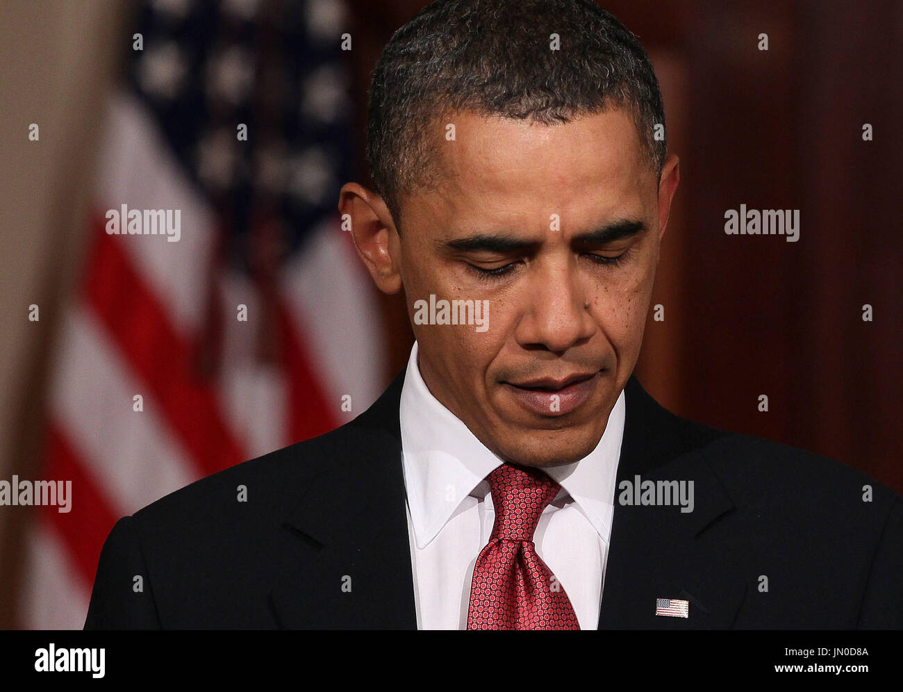 United States President Barack Obama looks down while making a ...