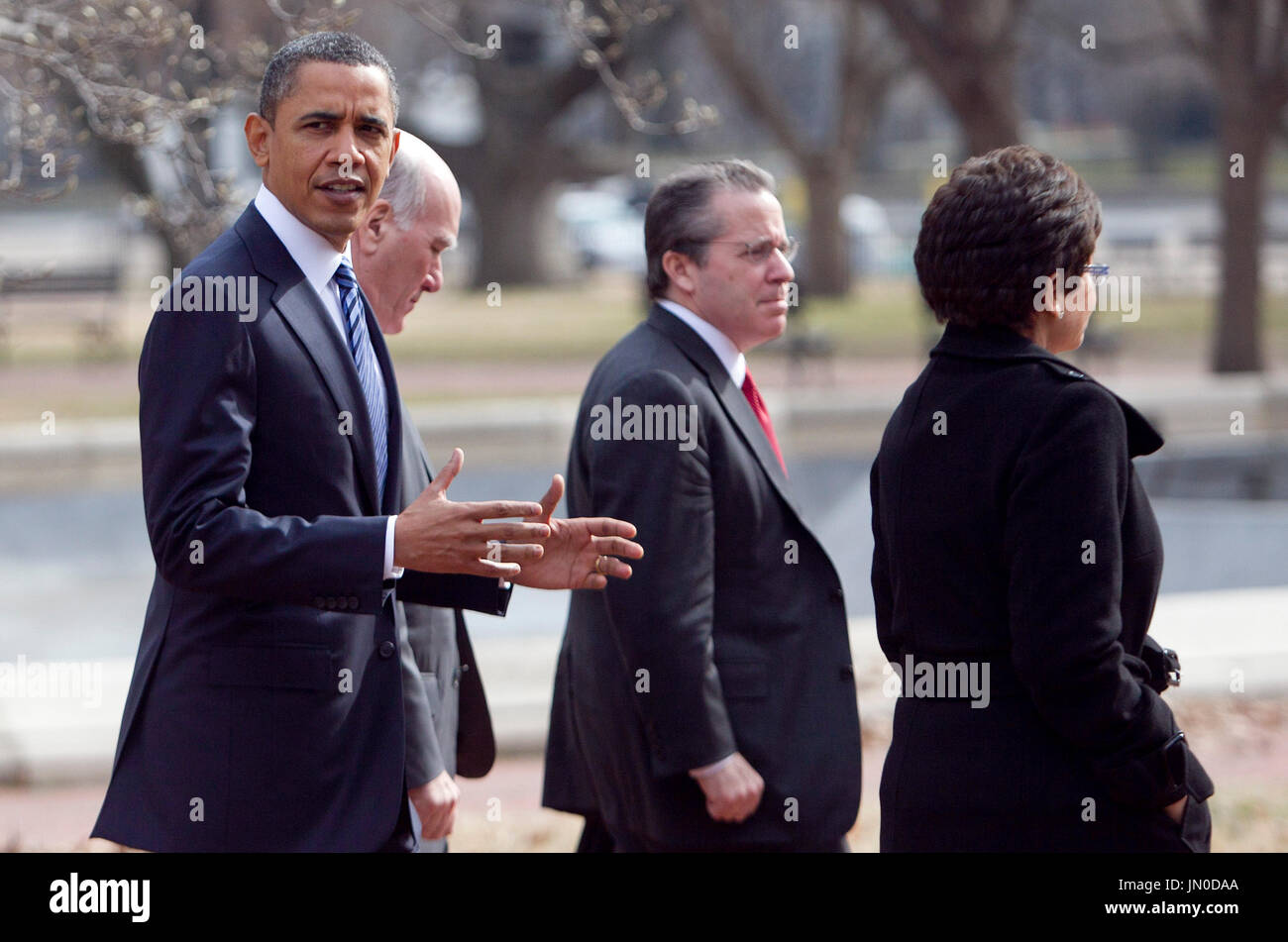 United States President Barack Obama, left, walks across Lafayette Park ...