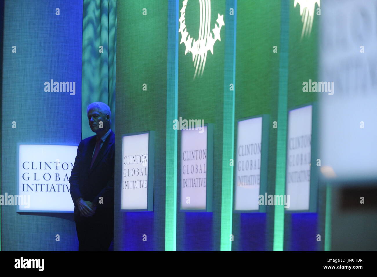 Former United States President Bill Clinton listens after introducing U ...