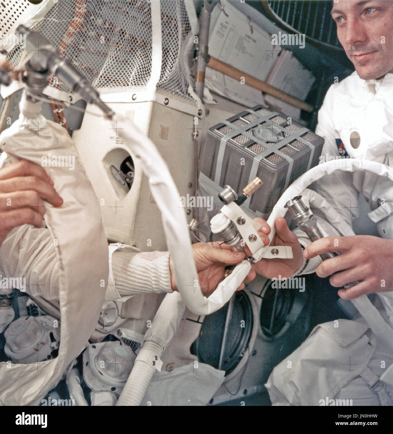 Astronaut John L. Swigert, Jr., Apollo 13 Command Module Pilot, holds ...