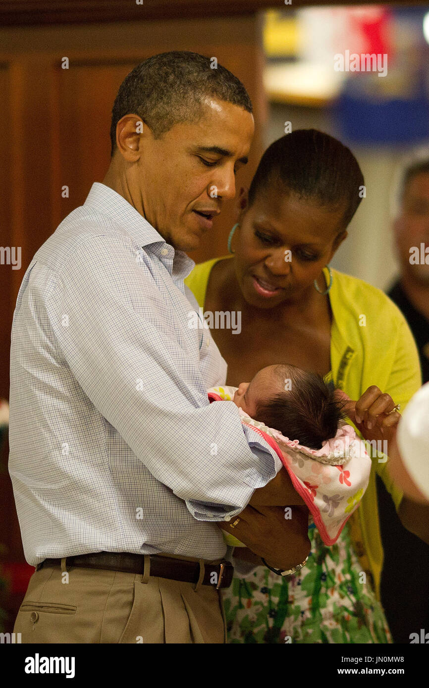 United States President Barack Obama holds one month old Adeline ...