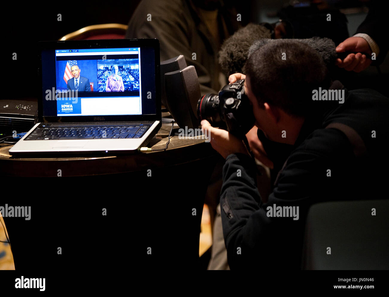 Reporters record United States President Barack Obama who is shown on ...